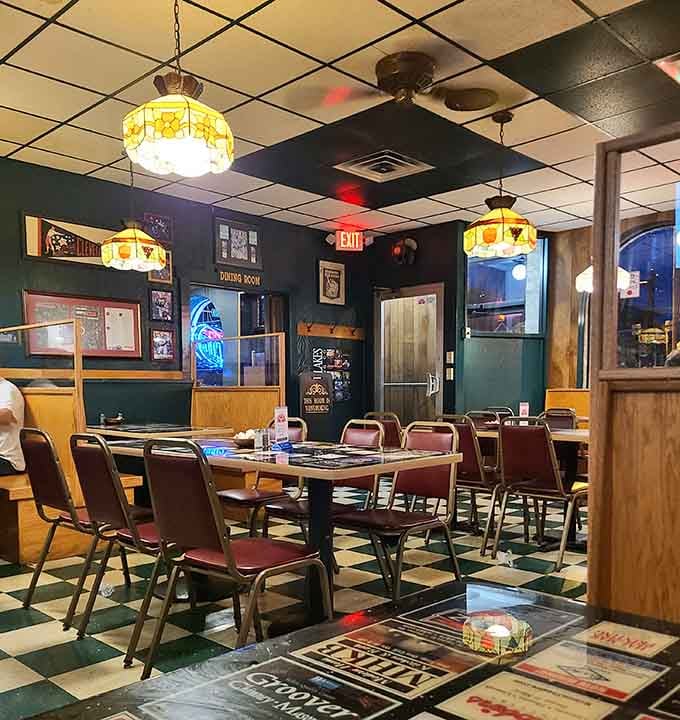 Classic booths, stained glass lamps, and checkered floors create the perfect backdrop for serious pizza consumption.
