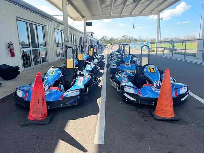 Those sleek blue karts lined up like eager racehorses at the starting gate, just waiting to unleash some speed.