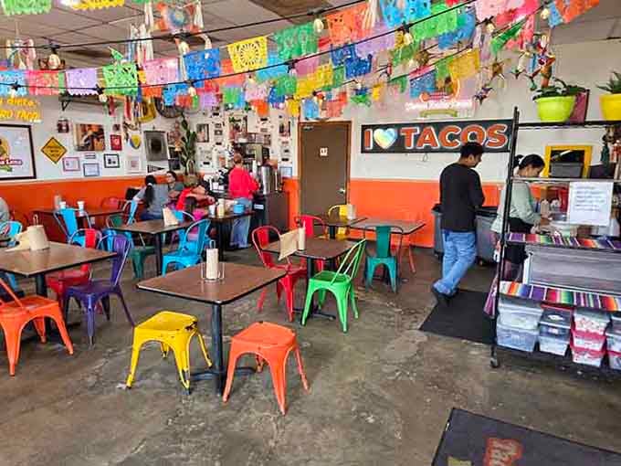 Rainbow chairs and festive decorations create an atmosphere where calories don't count and worries disappear with every bite.