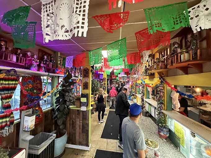 Walking through this papel picado wonderland feels like stepping into the world's most delicious fiesta every single day.