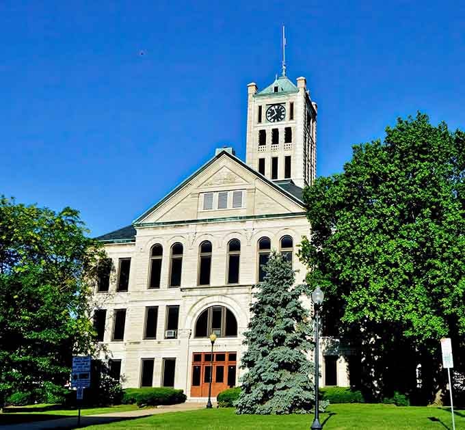 The Christian County Courthouse stands proud with its clock tower, proving government buildings don't have to look like concrete bunkers.