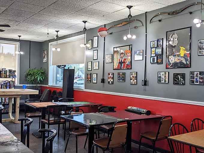 Gray walls meet red accents in a space where gaming art shares wall space with your next favorite meal.