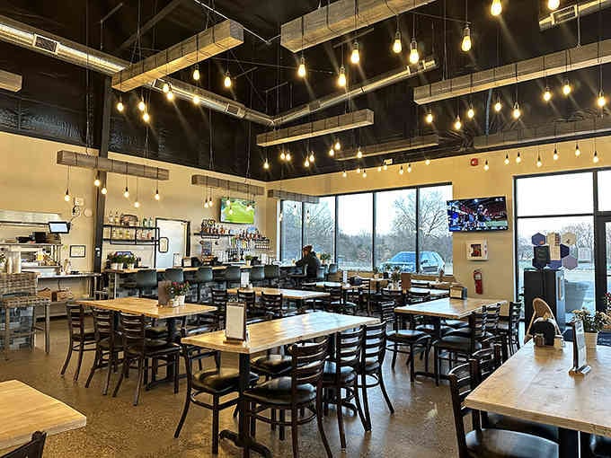 Industrial chic meets comfort food central, with Edison bulbs casting that perfect golden hour glow year-round.