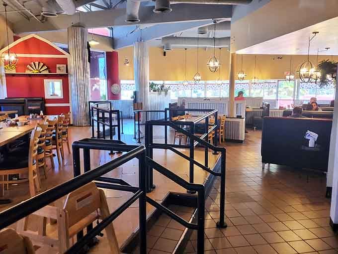 Inside, the farmhouse charm meets modern comfort, where corrugated metal and cheerful decor create the perfect biscuit-eating atmosphere.