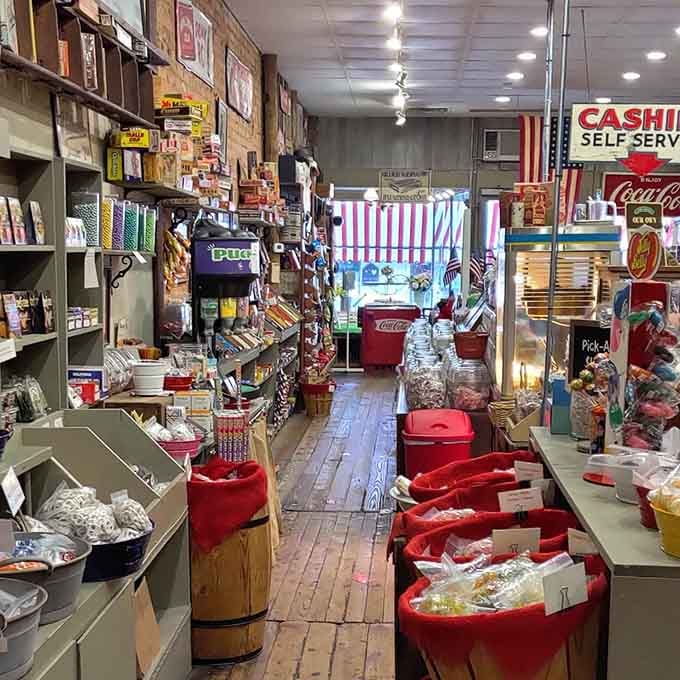Red barrels overflow with candy treasures, creating a rainbow pathway that leads straight to your childhood memories.
