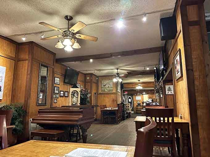 Wood paneling and comfortable booths create the kind of welcoming atmosphere where strangers become friends over dinner.