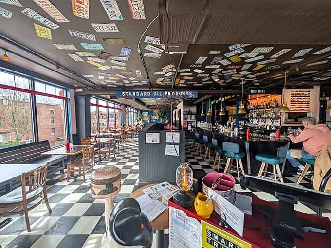 A ceiling covered in license plates and vintage signs creates the perfect backdrop for serious burger contemplation.