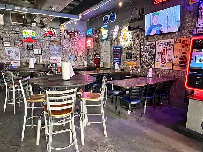 When dollar bills wallpaper the ceiling like financial confetti, you know you've found a place with serious character and stories.