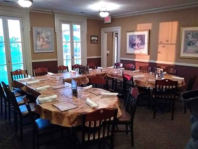 Classic tablecloths and warm lighting create the kind of comfortable dining room where celebrations and Tuesday nights feel equally special.