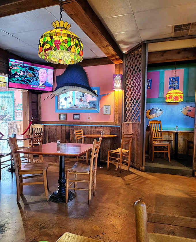 Stained glass lamps and colorful walls create a whimsical nautical wonderland that's pure coastal escapism in Kentucky.