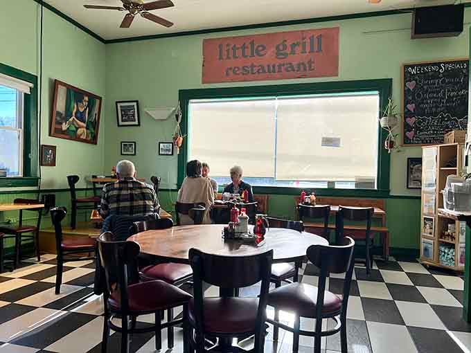 Step inside where mismatched furniture somehow creates perfect harmony, like a breakfast symphony conducted by comfort itself.