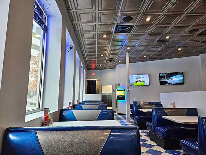 Blue booths and checkered floors create the perfect diner vibe without feeling like a time capsule museum.