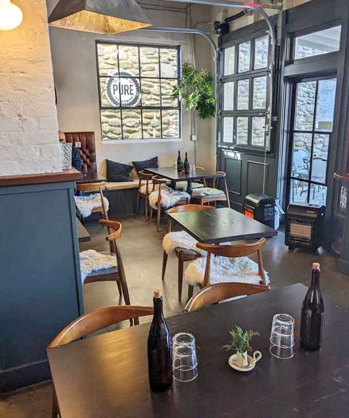 Exposed brick, natural light, and thoughtful design create an atmosphere worth savoring before your food arrives.