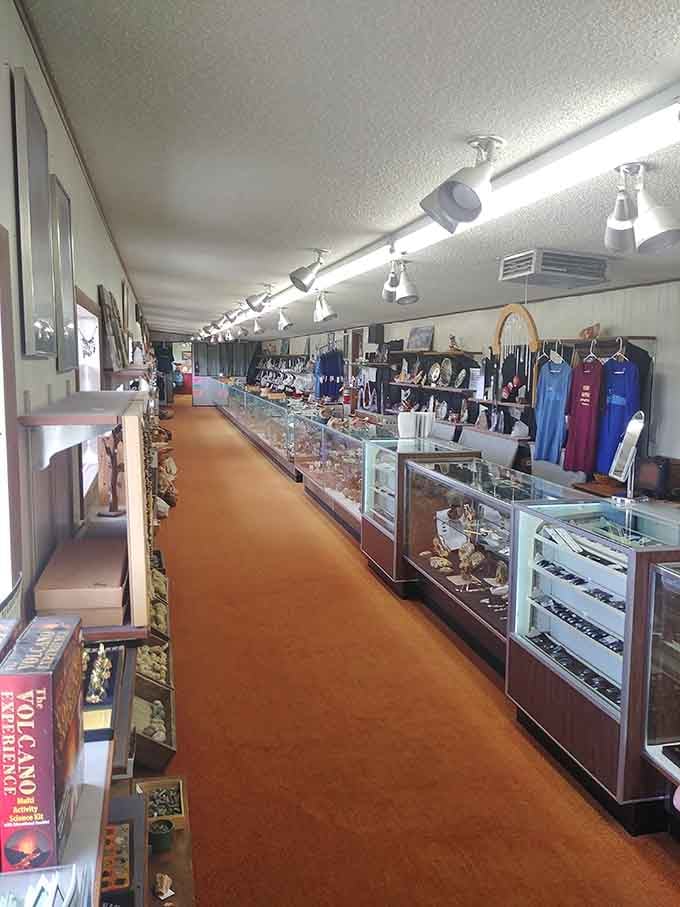 This corridor of cases stretches like a mineral museum designed by someone who never learned the word "enough."