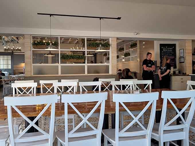 Clean lines, warm wood, and white chairs that practically beg you to settle in for a leisurely breakfast marathon.