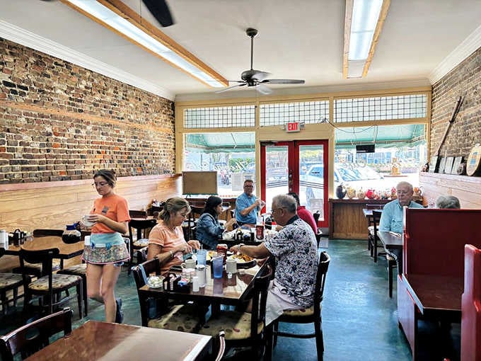 Exposed brick walls and natural light create the perfect backdrop for your morning coffee and conversation ritual.