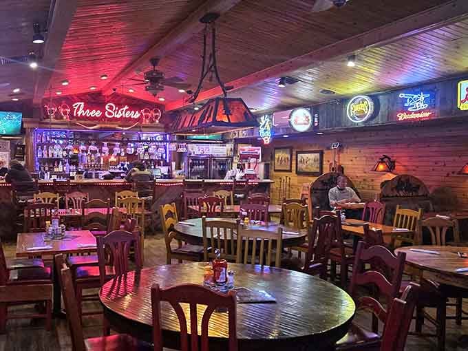 Neon glow meets Western charm in a dining room that somehow makes corrugated metal look downright cozy.