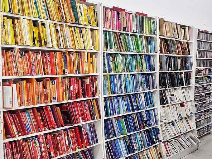 Books organized by color create a rainbow of reading possibilities that would make any librarian swoon.