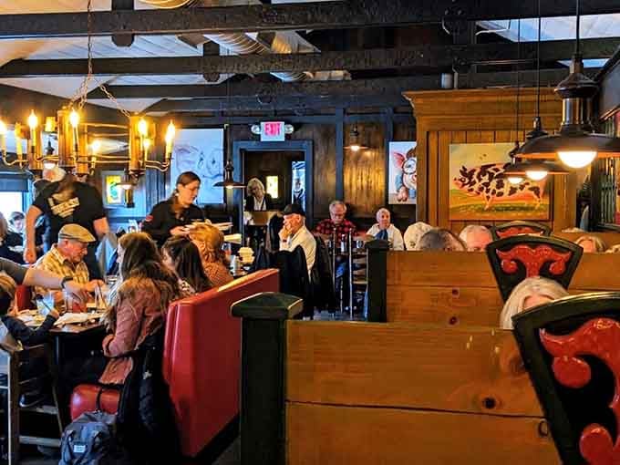 Inside, warm lighting and wooden beams create the kind of cozy atmosphere where strangers become friends over dinner.