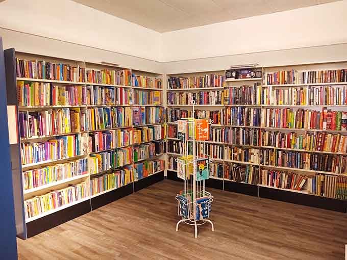 Floor-to-ceiling books organized like a proper library&mdash;because even thrift stores deserve to look this sophisticated and inviting.