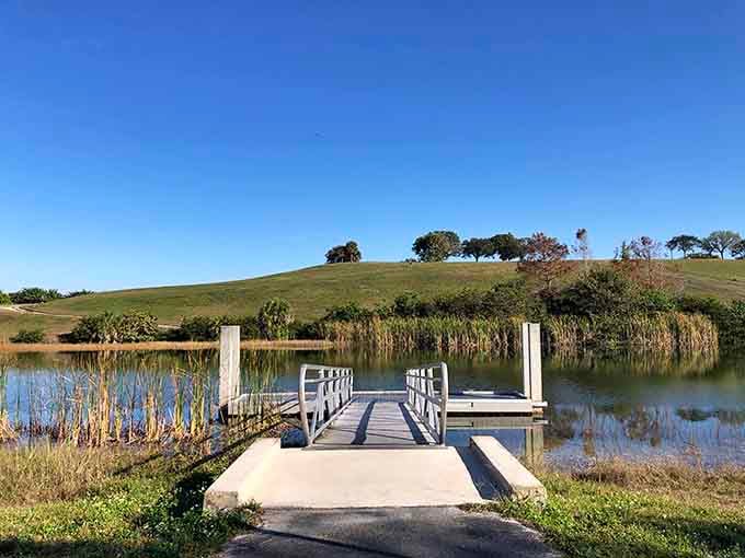 This peaceful pier invites contemplation and maybe a little fishing, with rolling hills providing a backdrop you won't believe.