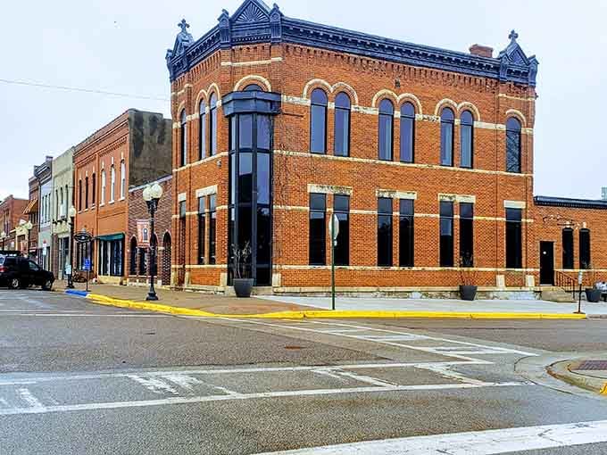 That corner building has more architectural personality than most modern strip malls could ever dream of achieving.