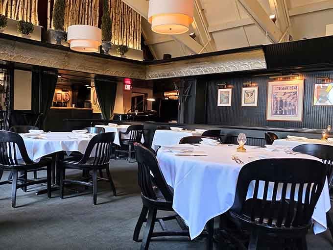 White tablecloths and classic chairs create an atmosphere where comfort food meets genuine elegance without any pretense.