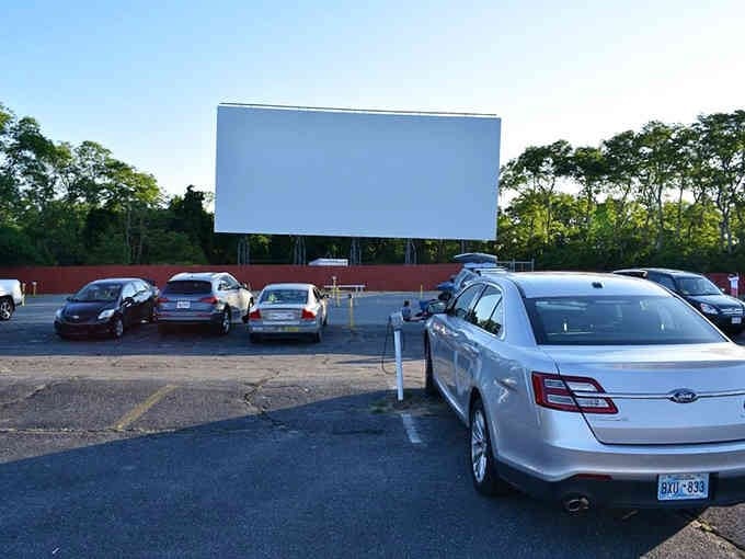 That towering screen against the Cape Cod sky is your invitation to simpler times and better evenings.