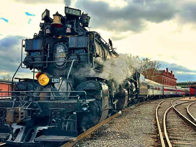 Steam billowing into mountain air while this beauty sits at the station, ready to transport you back in time.