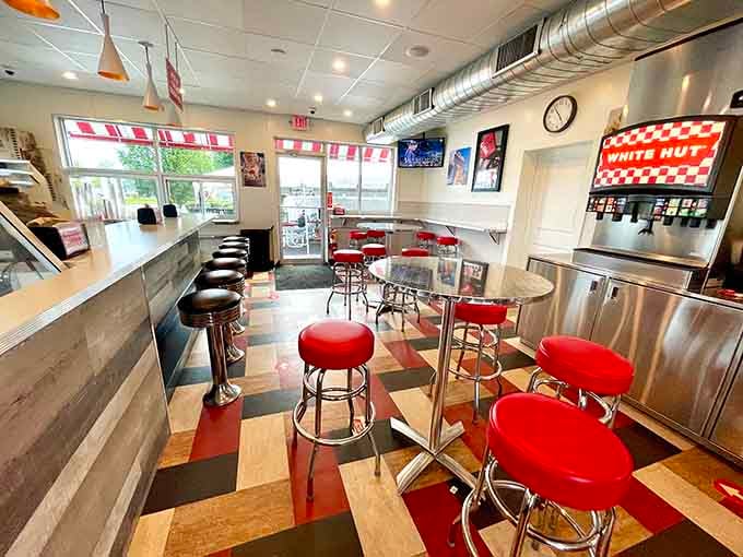 Chrome stools and red accents create the kind of timeless diner atmosphere that makes smartphones feel unnecessary.