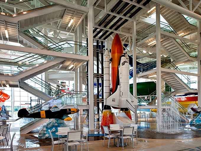 Inside, aviation meets aquatic adventure with rockets, planes, and slides creating the most wonderfully chaotic indoor playground imaginable.