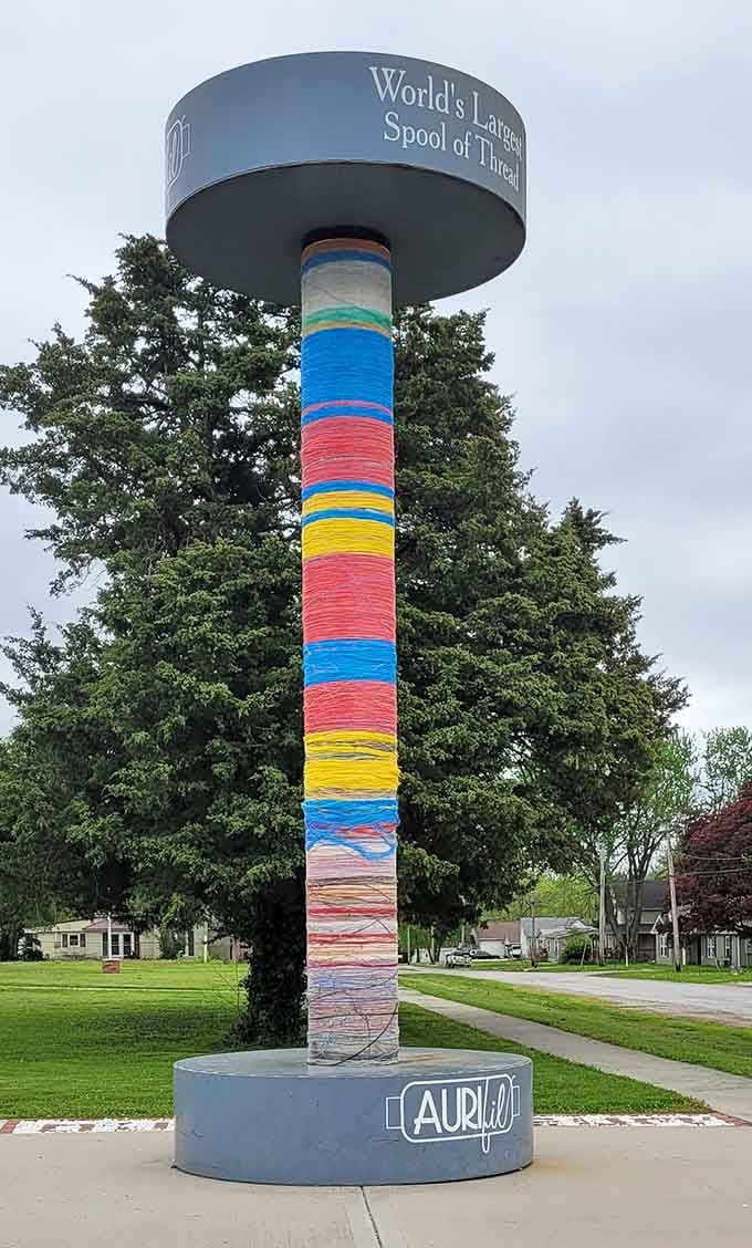 Those rainbow stripes wrapping around the tower make it look like a candy cane designed by quilters.