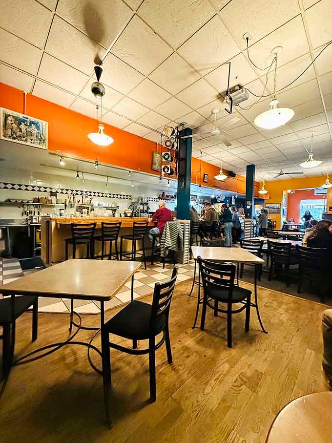Orange walls and eclectic vibes create the perfect backdrop for your next favorite meal and maybe a concert.