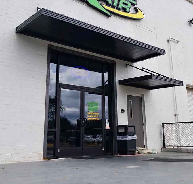 The entrance might look unassuming, but beyond those doors lies your ticket to feeling ten years old again.