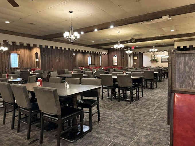 Dark wood, comfortable chairs, and chandeliers create the perfect setting where casual meets classic steakhouse charm.