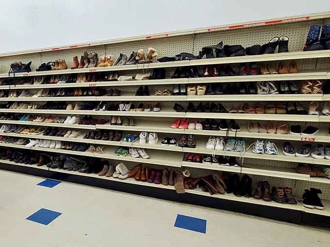 Rows of shoes organized like a department store, proving thrift shopping doesn't mean chaos anymore.