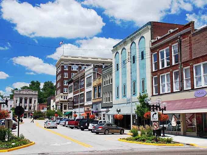 Alton's hillside architecture stacks up beautifully, with buildings climbing toward those puffy clouds like ambitious neighbors.
