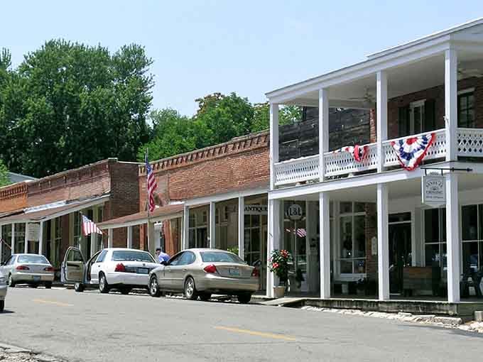 That double-decker porch with patriotic bunting practically begs you to sit with lemonade and watch history stroll by.