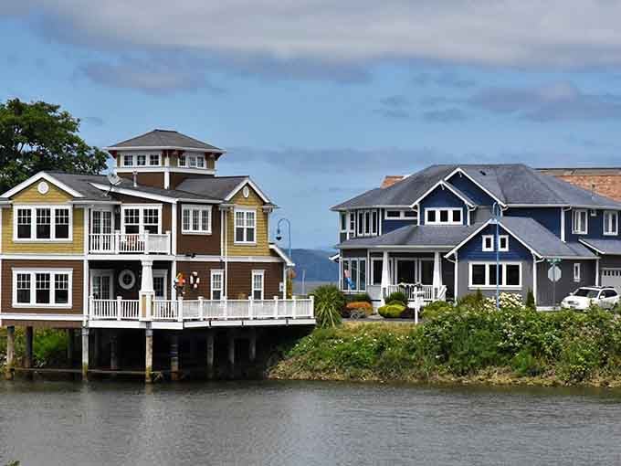 Colorful beach houses perch above the water, each one claiming the best seat for the daily sunset show.
