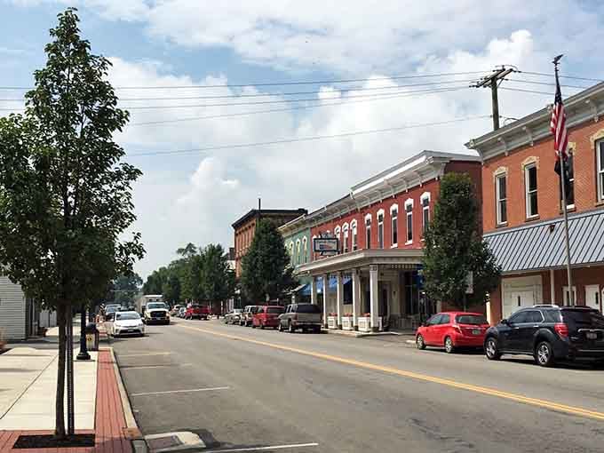 Tree-lined streets and historic facades create a scene straight from a Norman Rockwell painting.