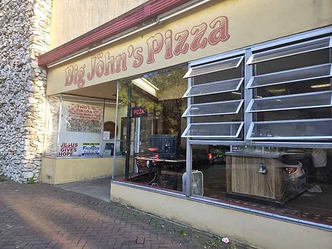 Big John's classic storefront with its vintage lettering proves that great pizza doesn't need fancy packaging to shine.