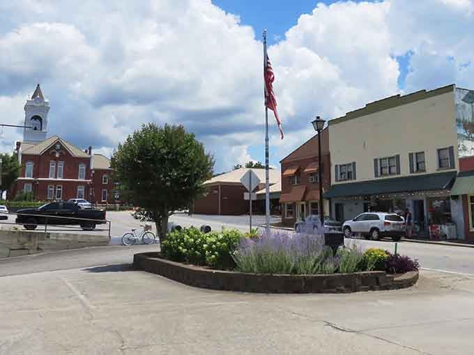 That brick courthouse stands proud under blue skies, anchoring a town square where neighbors still know each other's names.