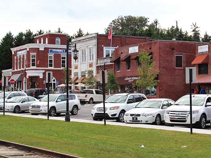 Red brick buildings nestled among pine trees create a mountain town postcard you can actually visit.