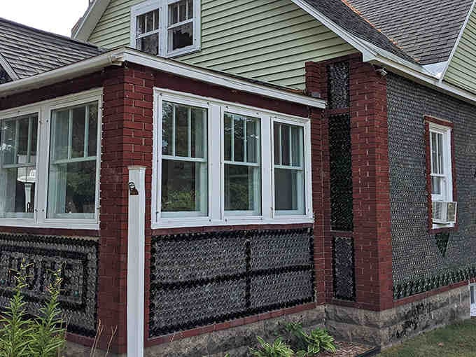 Thousands of glass bottles create shimmering patterns across these walls, turning recycling into pure architectural magic.