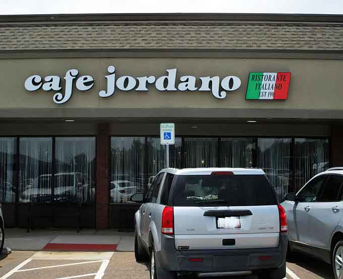 That Italian flag and elegant script promise authentic flavors hiding in this unassuming strip mall storefront.
