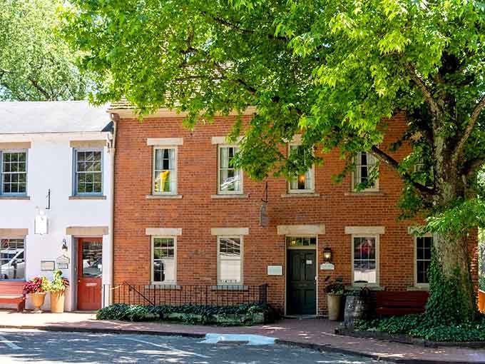 Shaded brick storefronts with flower boxes create the kind of Main Street charm your wallet will actually appreciate.