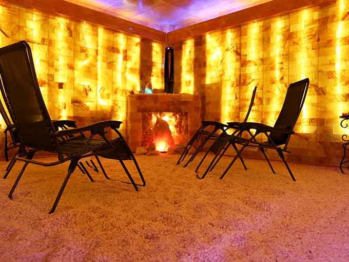 Golden Himalayan salt walls glow like a warm sunset, turning your breathing session into a visual masterpiece.