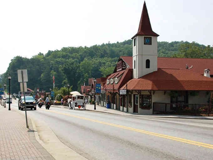 Is it Georgia or Bavaria? This steeple is cleaner than my Sunday best, nestled perfectly against lush, rolling hills.