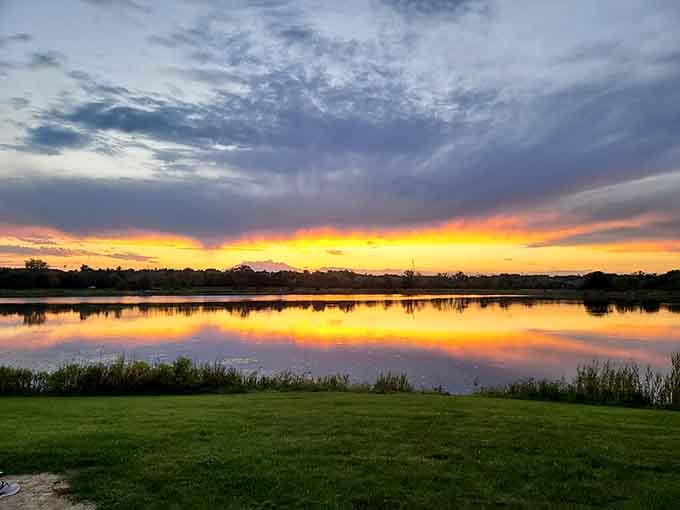 When the sunset paints the sky like a Bob Ross masterpiece, this lakeside view becomes pure Illinois gold.