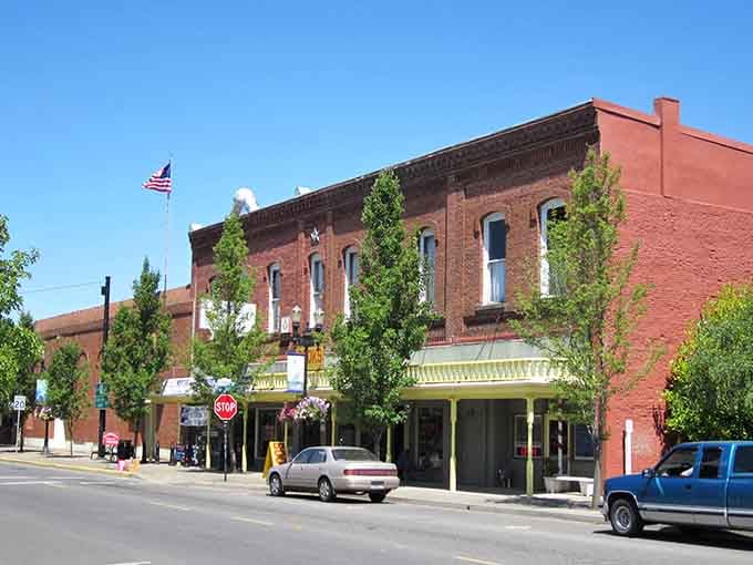 Historic brick buildings frame blue skies perfectly, like a postcard from America's friendlier past come to life.